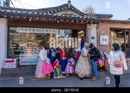 SEOUL - Girls in traditional Korean hanbok dresses walk past the ...