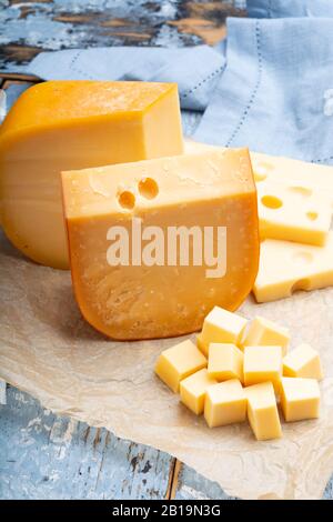 Famous hard cheeses, Dutch Gouda and French Emmentaler in pieces and ...