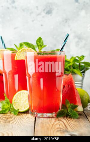 Glasses with fresh watermelon juice and lime on light background Stock ...