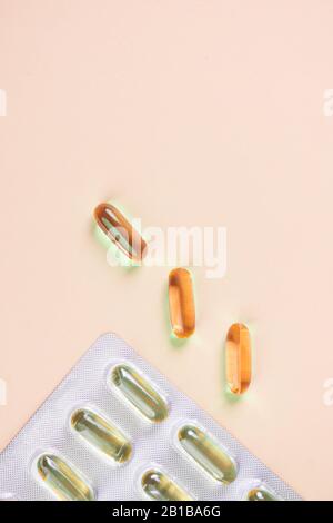 Yellow vitamin soft gelatin capsules with oily drug and nutritional ...