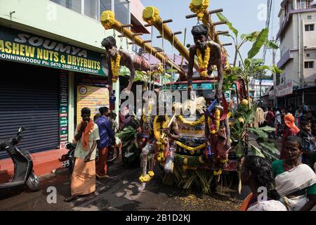 Devotees hanging by hooks piercing their skin as a ritualistic act of ...