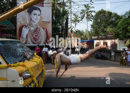 Devotee hanging by hook piercings as a ritualistic act of devotion ...