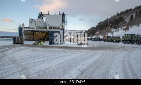 U.S. Marines and Norwegian Forsvaret soldiers prepare to on-load U.S ...
