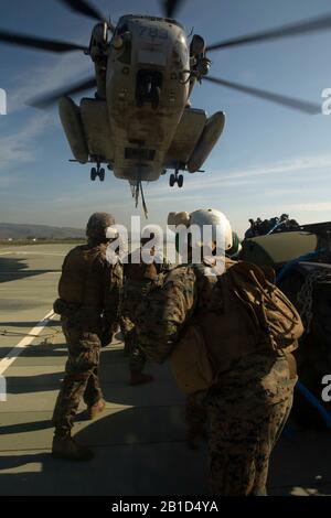 U.S. Marines with 1st Marine Logistics Group prepare to take their ...