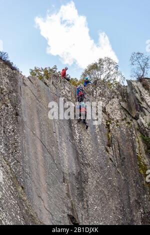 Team building exercises in Cathedral Cave Stock Photo - Alamy