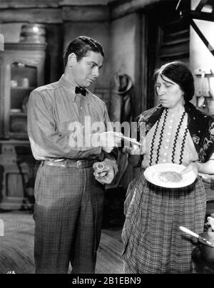 PAUL MUNI as Tony Camonte INEZ PALANGE and C. HENRY GORDON at Tony's ...