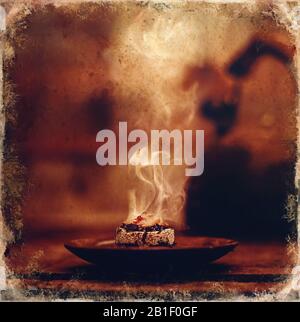 Frankincense burning on a hot coal. Frankincense is an aromatic resin ...