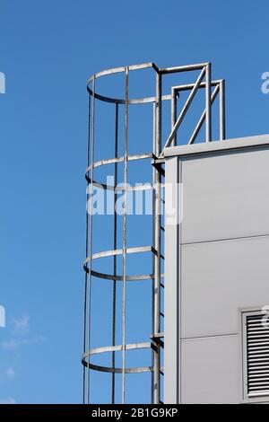 Vertical access ladders with round safety tunnel for use as emergency ...