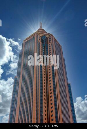 Sun rising behind the tall city skyline of Qingdao in China Stock Photo ...