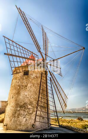 Old windmill and salt pans near Trapani at Sicily, Italy Stock Photo ...