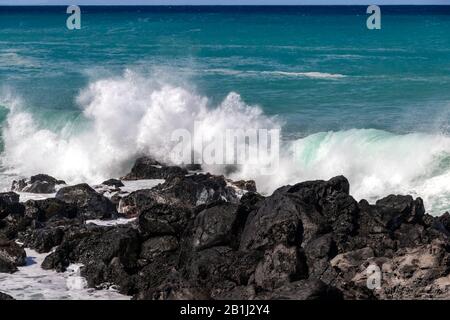 An Ocean Wave Is Breaking Against A Colorful Sunset Sky Stock Photo - Alamy