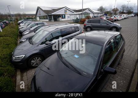 Aldi store front with cars in car park outside supermarket selling at ...
