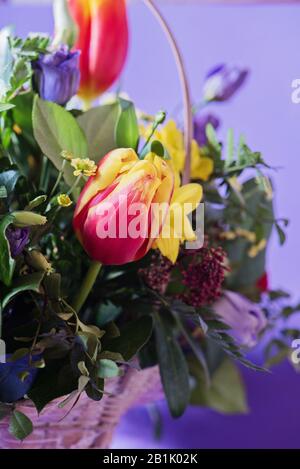 Colorful bouquet of different fresh flowers in the hands of florist ...