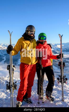 Skiers wait in line for a ski lift in Soriska planina, Slovenia. (Photo ...