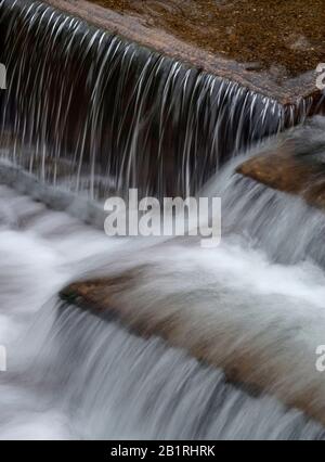 Water flowing over a stepped weir at Laxey on the Isle of Man, UK Stock ...