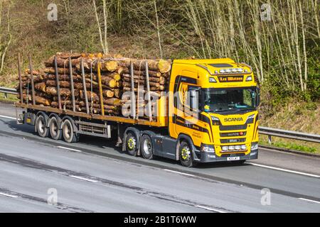 bulk wood timber construction materials stockpiled at a builders ...