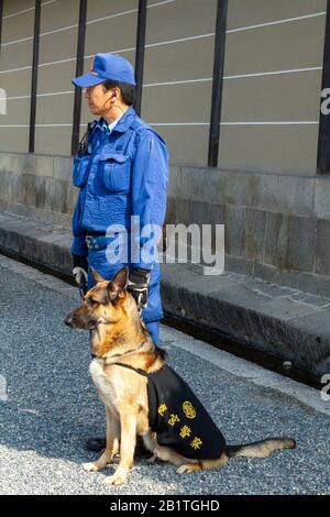 Japanese Guard with a watchdog at the Imperial Palace, Kyoto, Japan ...