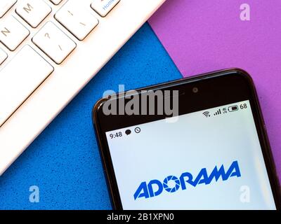 In this photo illustration an Adorama logo seen displayed on a ...