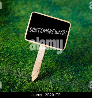DON'T SMOKE!, text written on red grungy postal stamp Stock Photo - Alamy