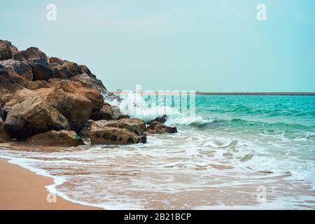 Beating the rock sea wave. Surf, waves, extreme sports Stock Photo - Alamy