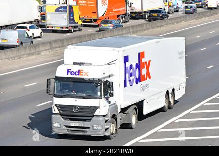 Side view FedEx Express transport delivering packages & freight via hgv ...