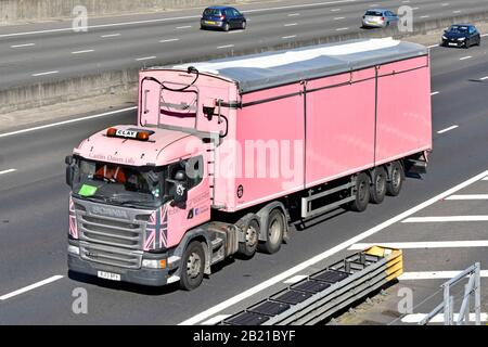 Side and front view of hgv haulage lorry truck & driver with new cars ...