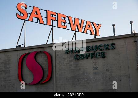 A logo sign outside of a Safeway grocery retail store location in Olney ...