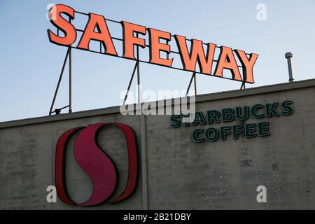 A logo sign outside of a Safeway grocery retail store location in Olney ...