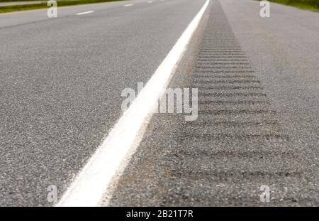 Pits on the asphalt road, a concept on the theme of bad roads Stock ...