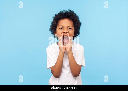 Upset child screaming. Mixed race Kid yelling roaring to camera, close ...