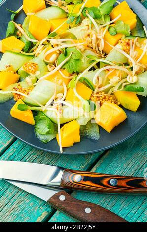 Sprouted green mung beans. Mung sprouts in bowl on wooden table Stock ...