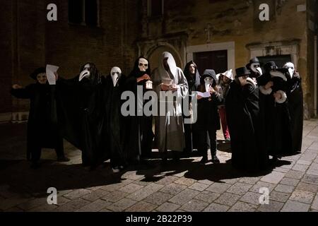 VENICE, ITALY - FEBRUARY 25: Plague doctors pose in Venice on February ...