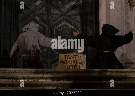 VENICE, ITALY - FEBRUARY 25: Plague doctors pose in Venice on February ...