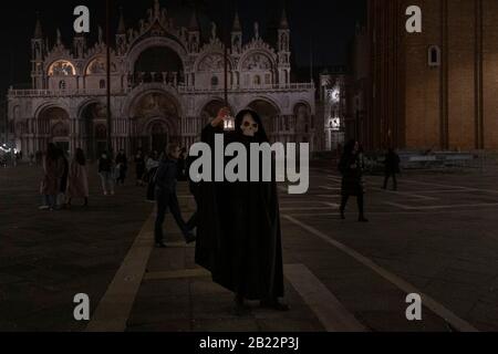 VENICE, ITALY - FEBRUARY 25: Plague doctors pose in Venice on February ...