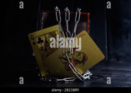 joker card and a box was locked by chain Stock Photo - Alamy