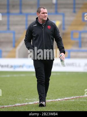 Kristian Woolf Head Coach of St Helens walks back to the dug out at ...