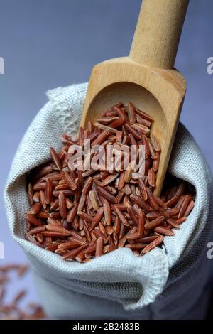 Red rice with wooden shovel, rice, Germany Stock Photo - Alamy