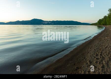 The curving shoreline of Stuart Lake in Paarens Beach Provincial Park ...