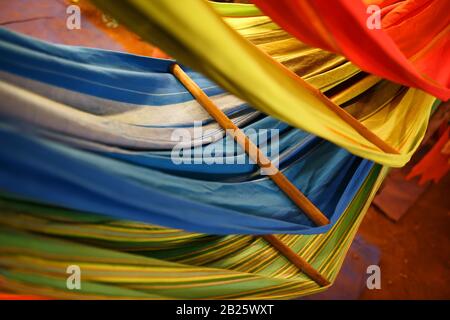Hammocks of different colors, colors of the rainbow on the night market ...