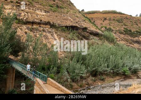 Walking bridge crossing the Liphiring River to the Ha Baroana rock ...