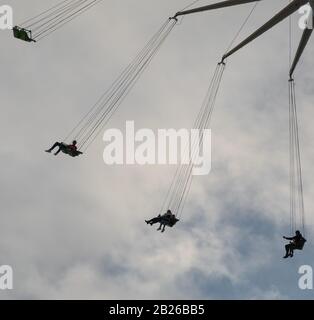 Thrill seekers enjoy flying high above the city centre on the City Star ...