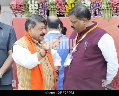BJP National Secretary Kailash Vijayvargiya speaks to MP Locket Chatterjee during the Amit Shah ...