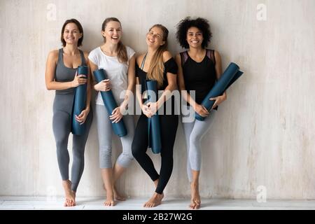 Young beautiful group of sportswomen smiling happy. Standing with smile ...