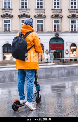 Young man riding a scooter. Vienna, Austria Stock Photo - Alamy