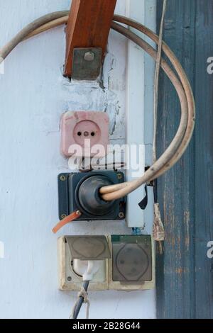 Very old electricity plug sockets in an old shed Stock Photo - Alamy