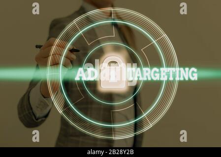 Writing note showing Ad Targeting. Business concept for target the most ...