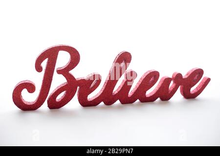 Red believe sign on white background Stock Photo - Alamy