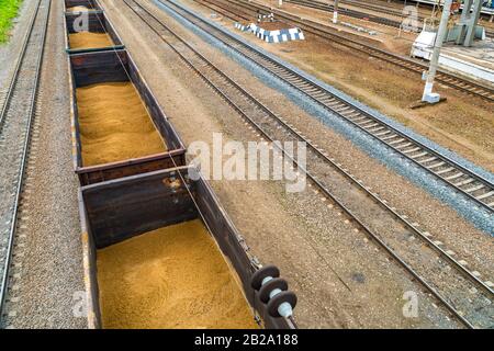 Freight train, the rail freight wagons with sand Stock Photo - Alamy