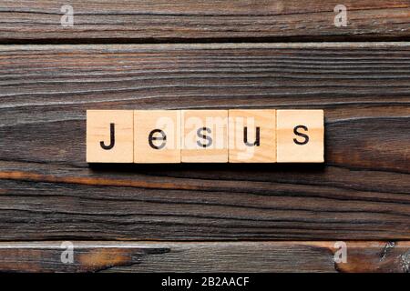 Jesus word written on wood block. Jesus text on table, concept Stock ...