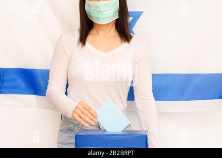 Israeli woman with face medical protected mask on Israel flag ...